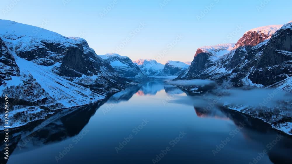 mountain reflection over water and snow. sky and lake framed by glacier ...