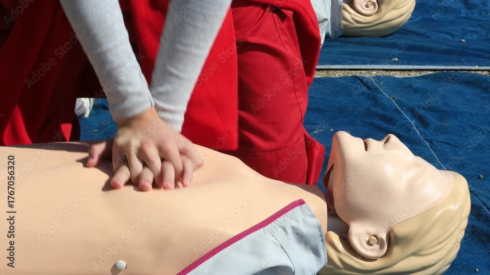 Cardiopulmonary resuscitation (CPR) training demonstration showing ...