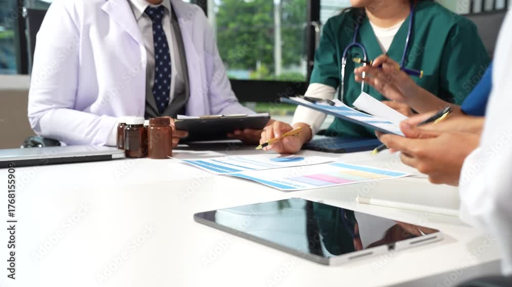Healthcare team reviews patient info, medication, and health progress ...