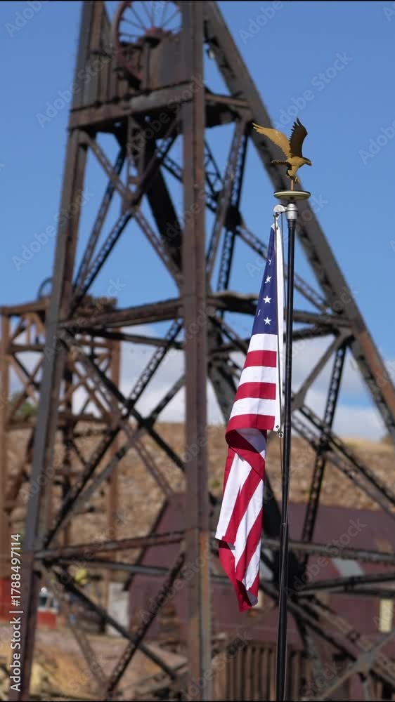 American flag in Cripple Creek, Colorado blowing in gentle breeze with ...