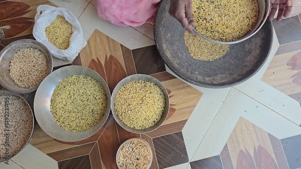 Cleaning pulses with a metal sieve (chalni) involves shaking them so ...