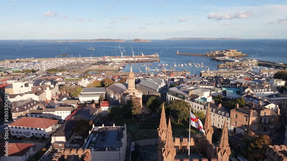 Flight over Elizabeth College St James and rooftops of St Peter Port ...