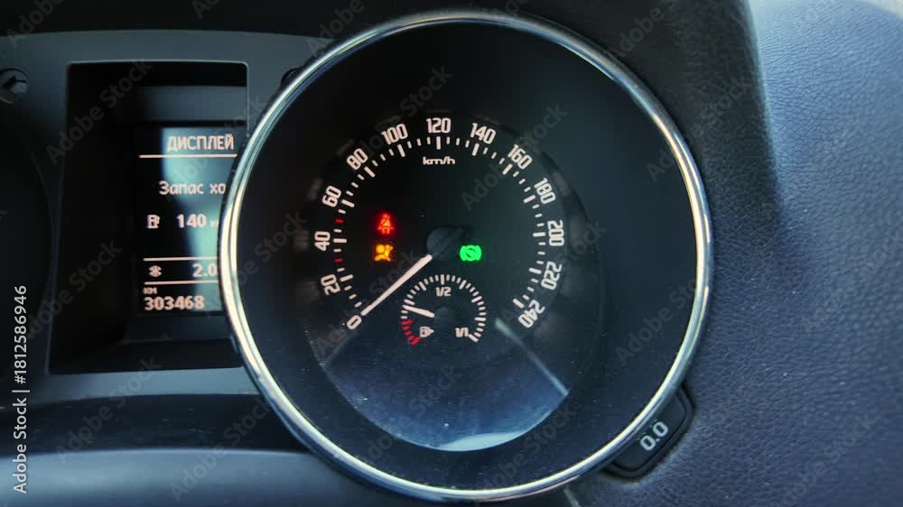 instrument cluster lighting up with speedometer and warning icons ...