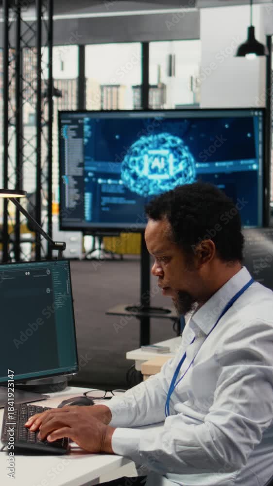 Vertical video Technician in office solving tasks with artificial ...