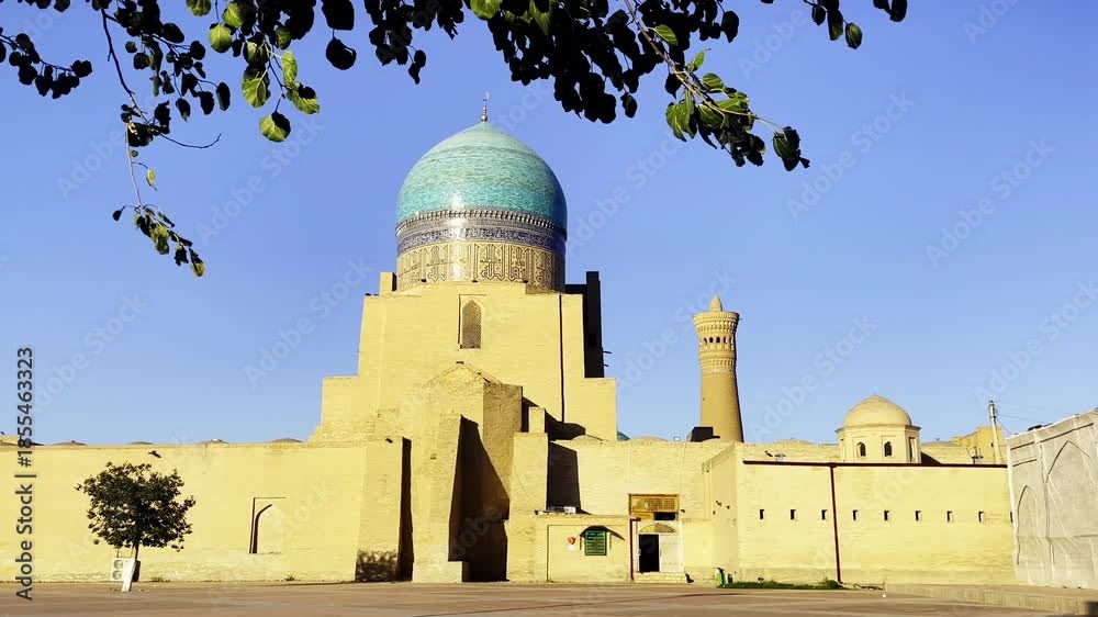 Po-i-Kalyan Mosque in Bukhara, Uzbekistan. The shot captures the blue ...