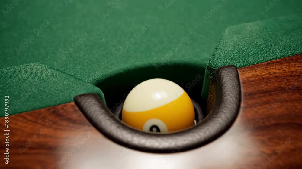 Cinematic overhead tracking shot following a striped billiard ball ...