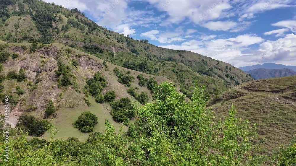 This 4K raw footage showcases the breathtaking panorama of Ollon Hill ...