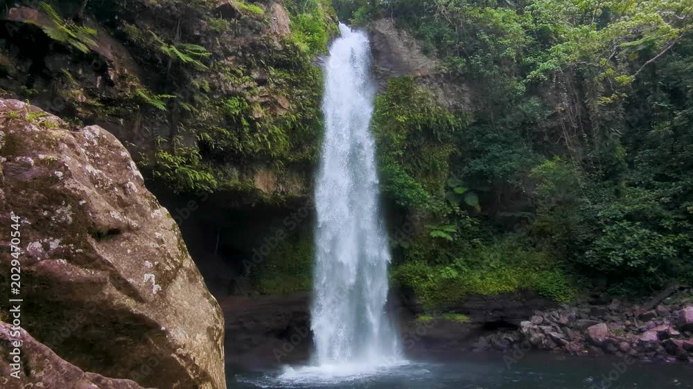 Scenic view Tavoro Waterfall and rugged landscape at Bouma National ...
