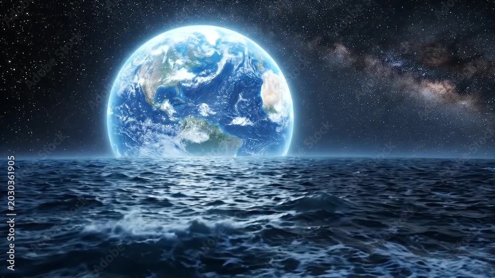 Earth rising over the ocean horizon in deep space with a starry galaxy ...