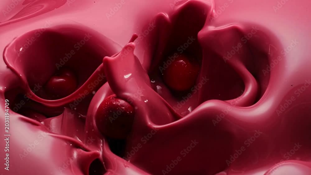 Fresh ripe cherries splash into a creamy cherry ice cream mixture ...