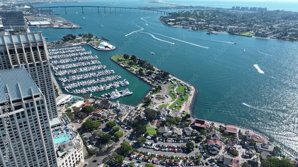 Cinematic high-angle drone shot looking over a yacht marina, waterfront ...